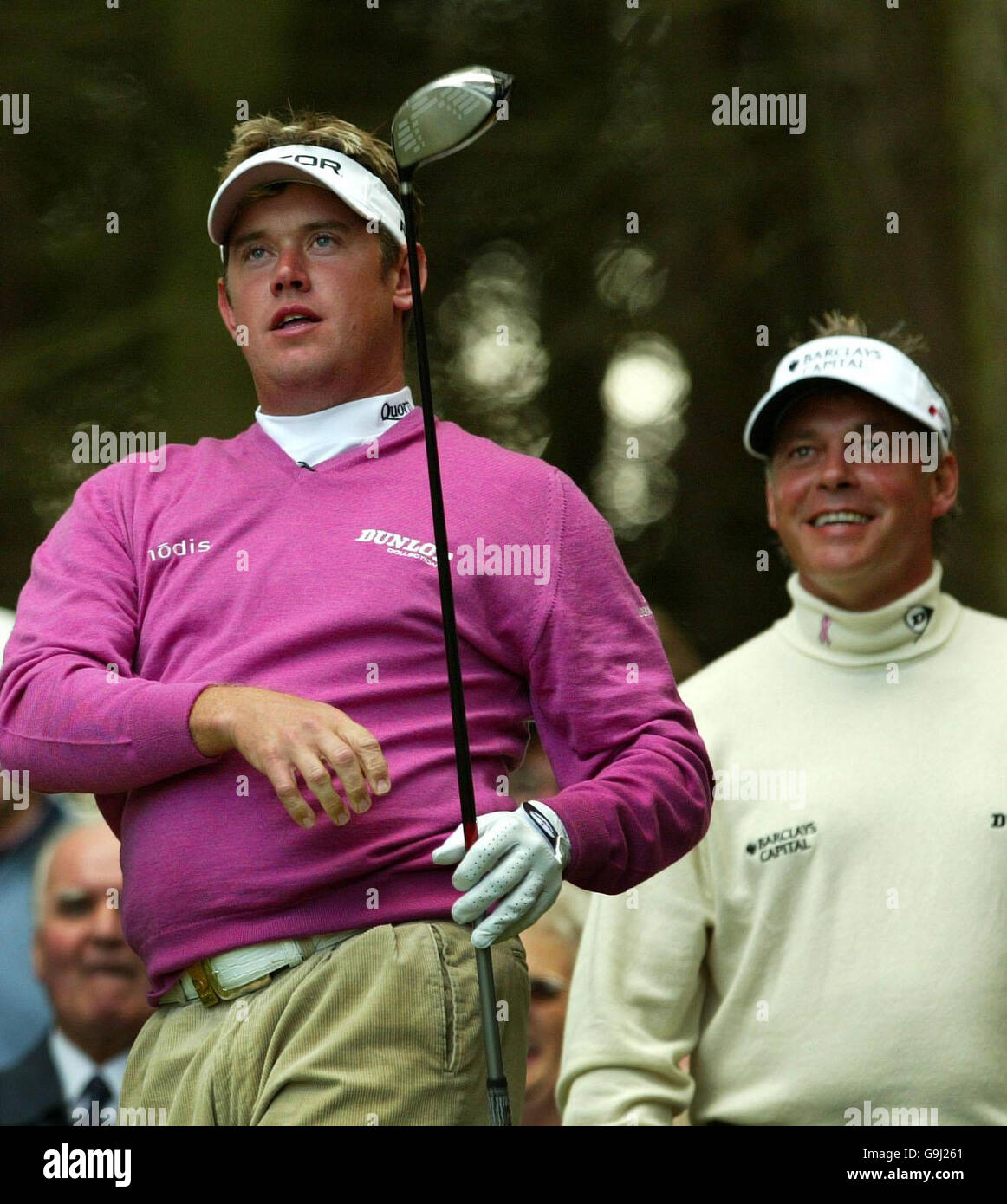 England's Lee Westwood (left) plays a shot as Northern Ireland's Darren ...