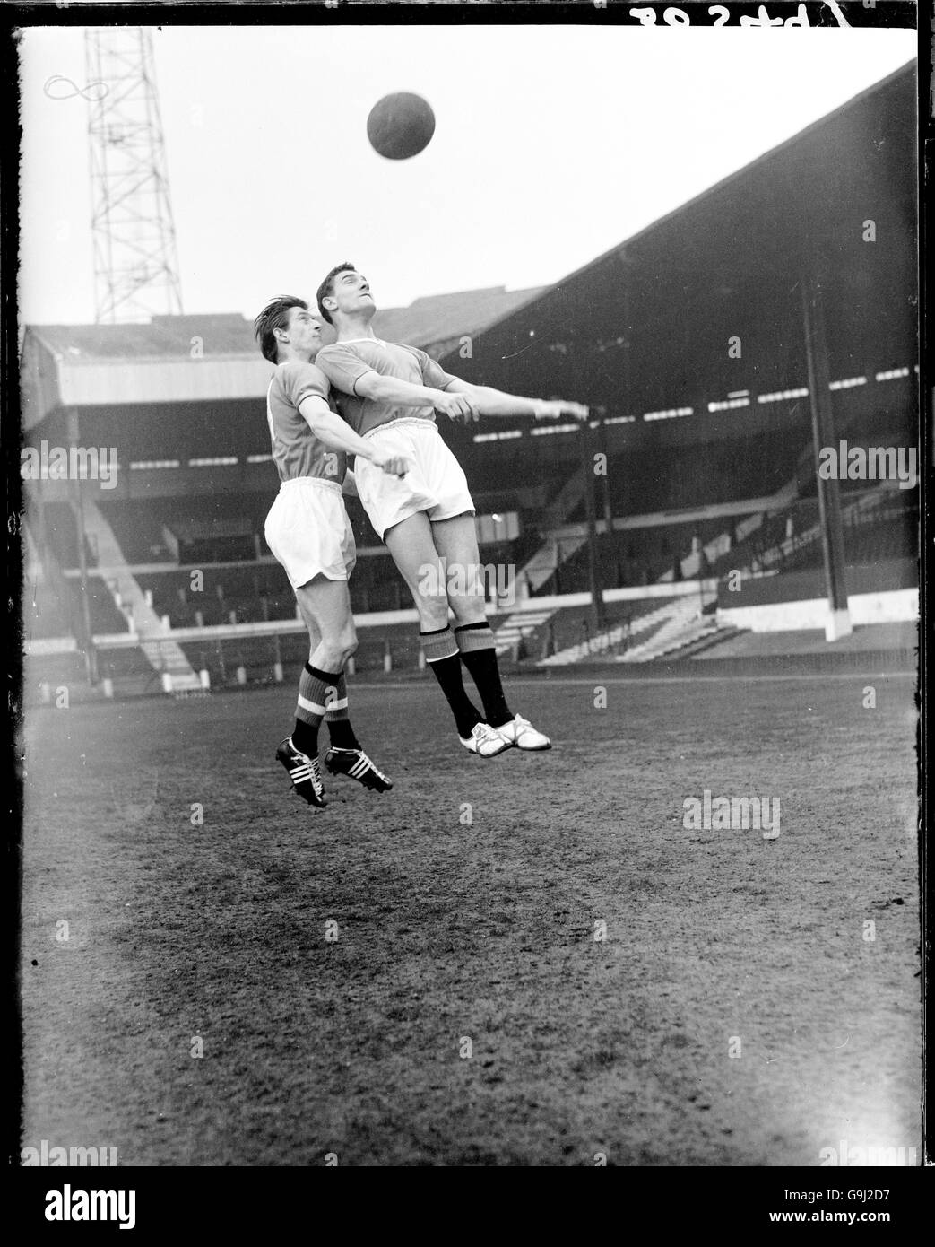 (L-R) Manchester United's Dennis Viollet and Bill Foulkes leap for a ...