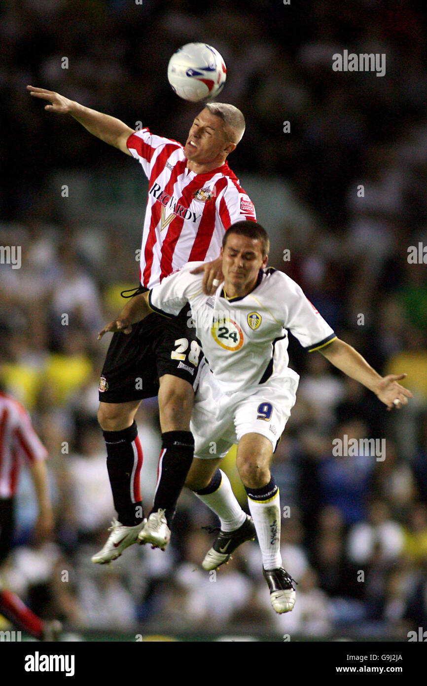 Sunderland's Graham Kavanagh wins a header over Leeds United's David ...
