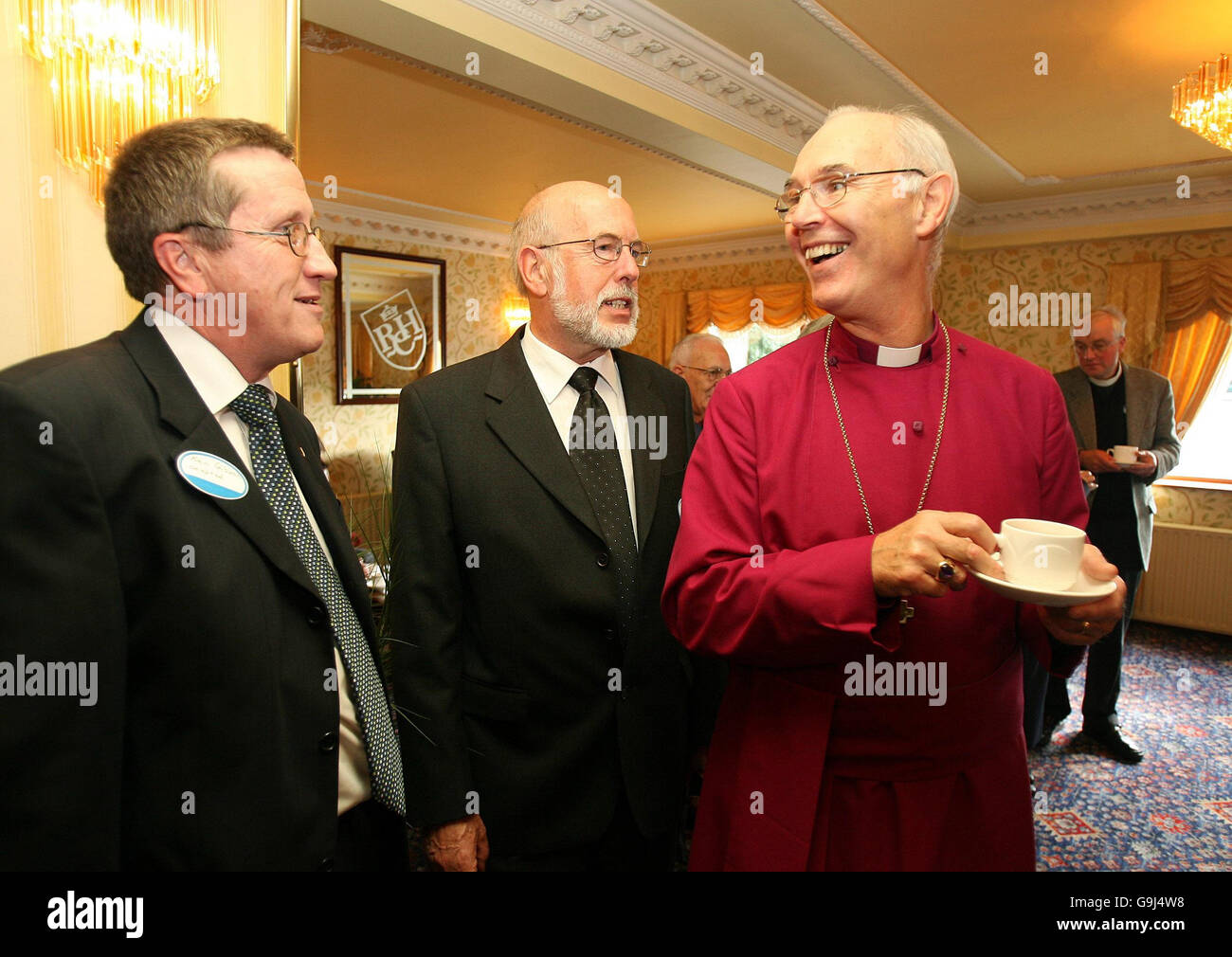 Bishop of Connor, the Rt Rev Alan Harper (right) talks with (from left ...