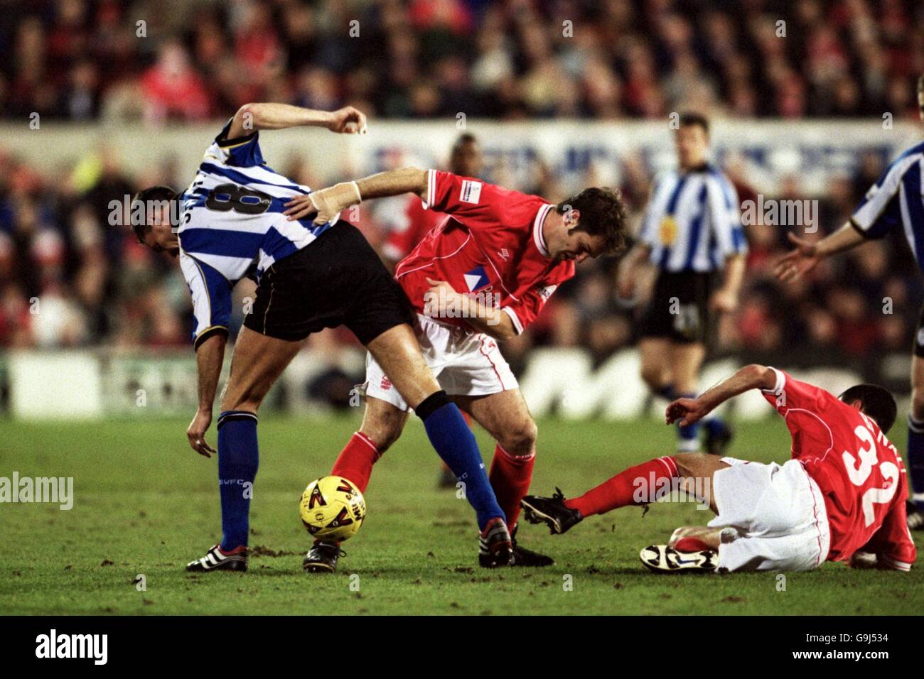 Nottingham Forest's Andy Johnson (centre) and Francis Benali (r) battle ...