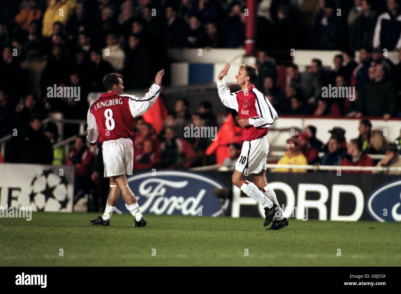 Arsenal's Dennis Bergkamp celebrates his goal against Olympique ...
