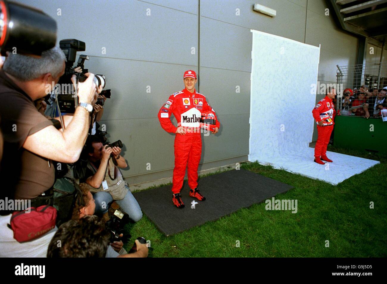 Michael Schumacher faces the press with team mate Rubens Barrichello as ...