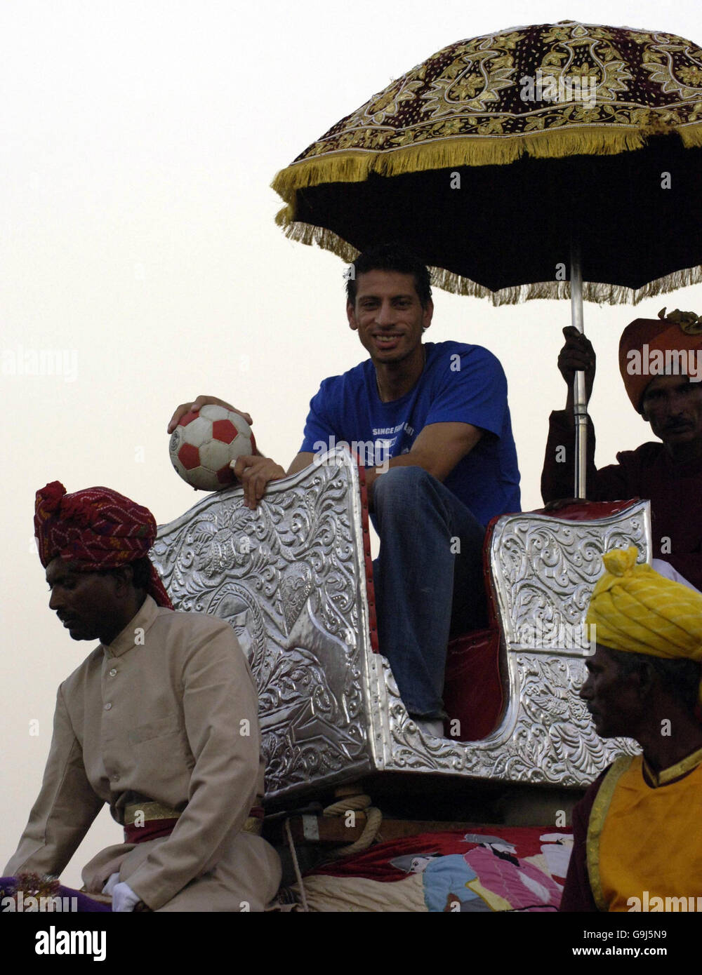 England's Sajid Mahmood on top of an elephant after acting as umpire in ...