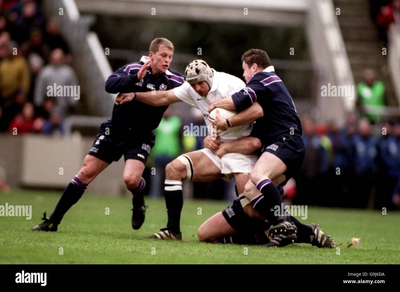England's Danny Grewcock is sandwiched between Scotland's Chris ...