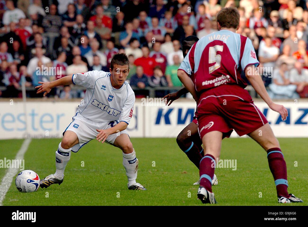 Brighton & Hove Albion's Sam Rents is surounded by Scunthorpe United's ...