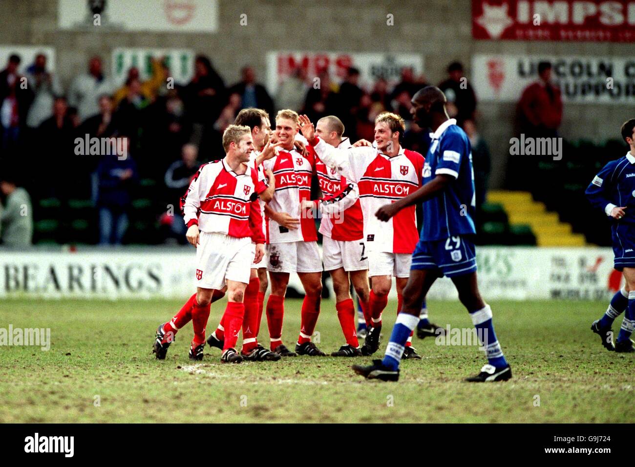 Lincoln City's Tony Battersby (15) is congratulated by his teammates ...