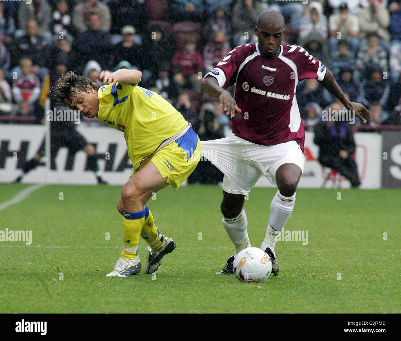 Heart's Ibrahim Tall and Kilmarnock's David Fernandez tussle for the ...