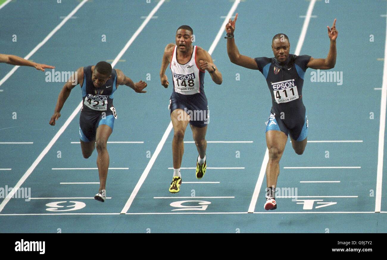 America's Tim Harden (r) celebrates winning the men's 60m final as his ...