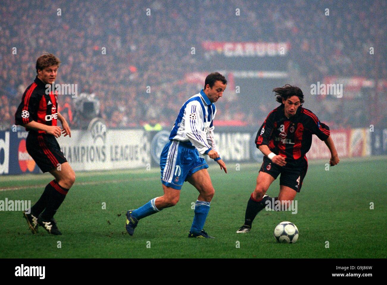 AC Milan's Demetrio Albertini (r) goes past Deportivo La Coruna's Fran ...