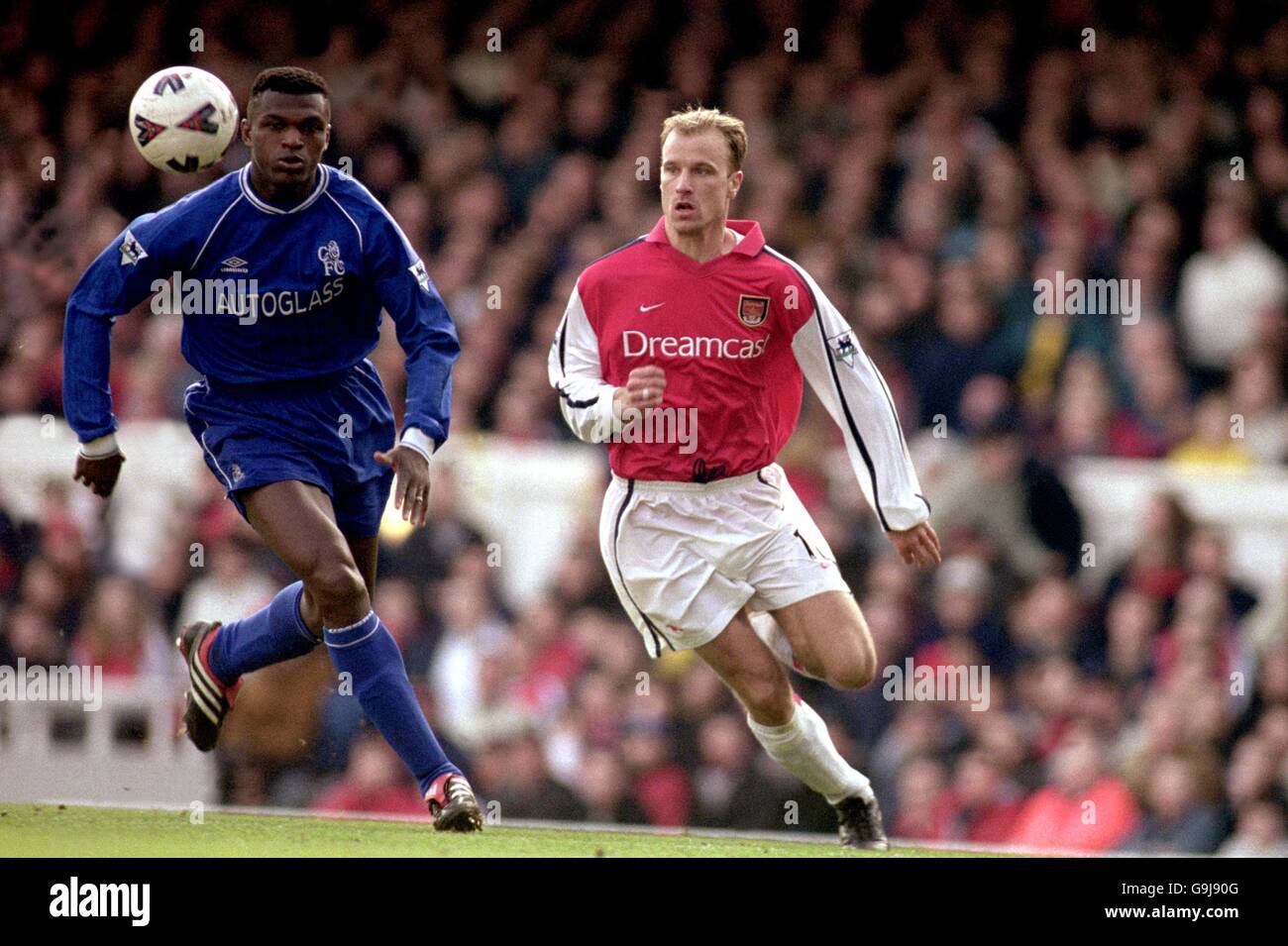 Chelsea's Marcel Desailly tracks back to cover the bouncing ball from ...