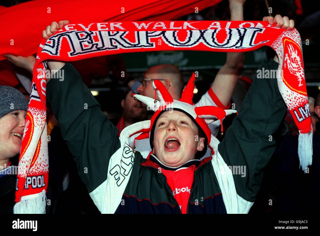 A Liverpool fan sings at the top of his voice after his teams victory ...