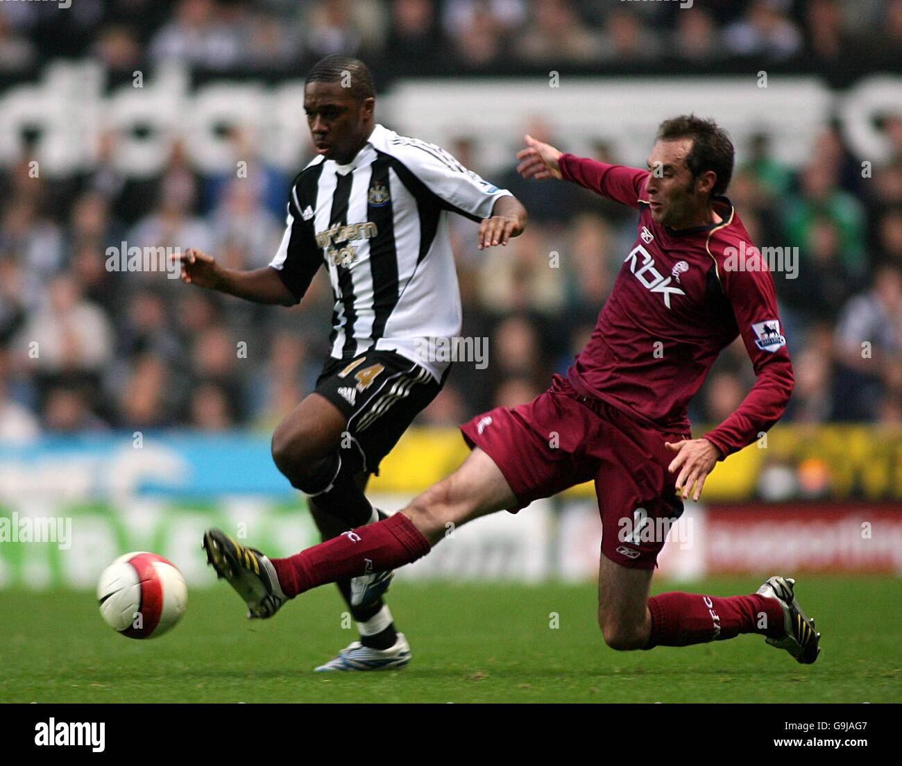 Bolton Wanderers' Nicky Hunt slides in on Newcastle United's Charles N ...