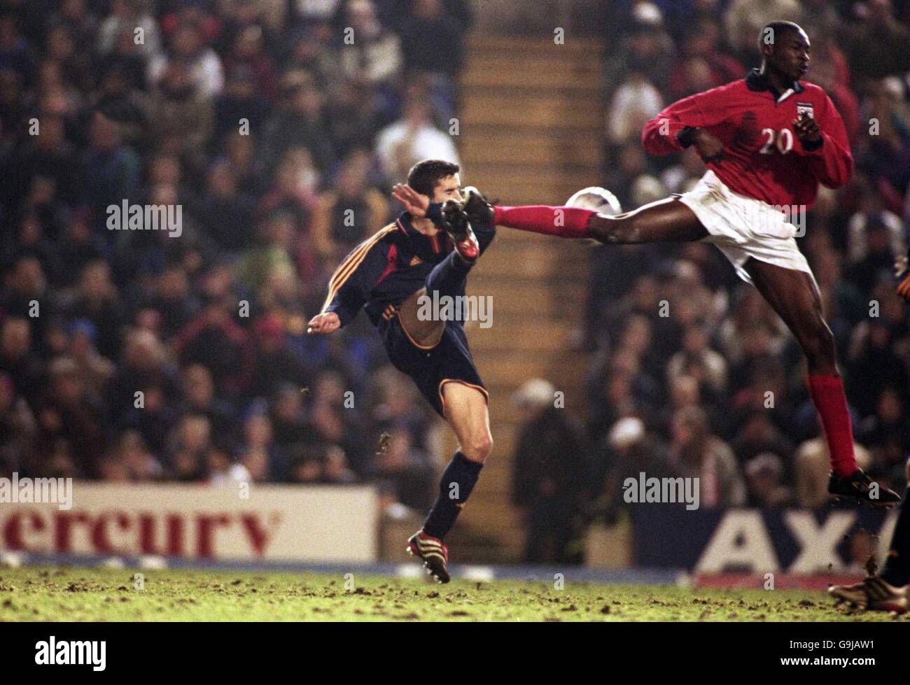 England's Shola Ameobi and Spain's David Bermudo battle for the ball ...