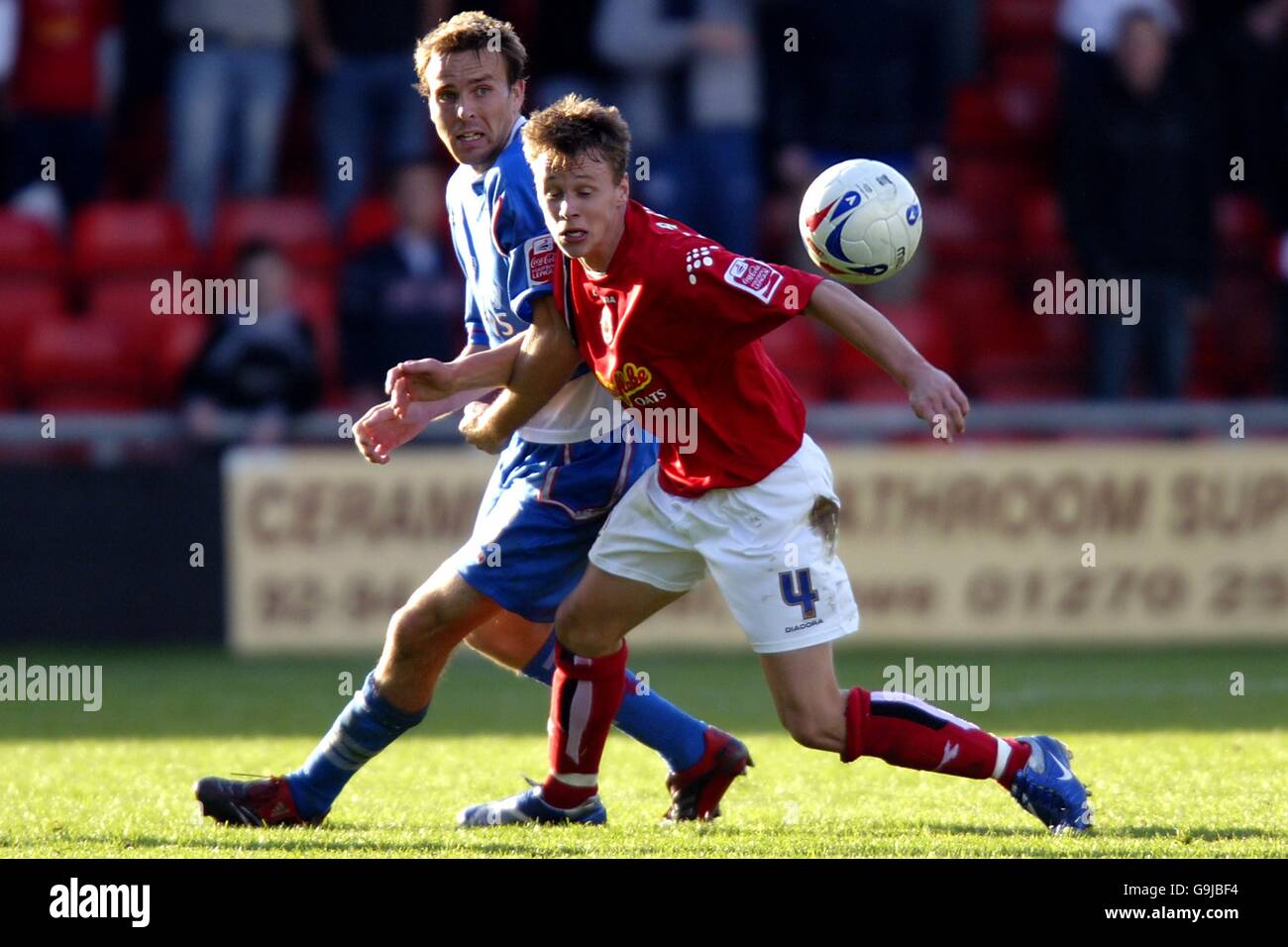 Crewe Alexandra's Gary Roberts and Gillingham's Mark Bentley compete ...