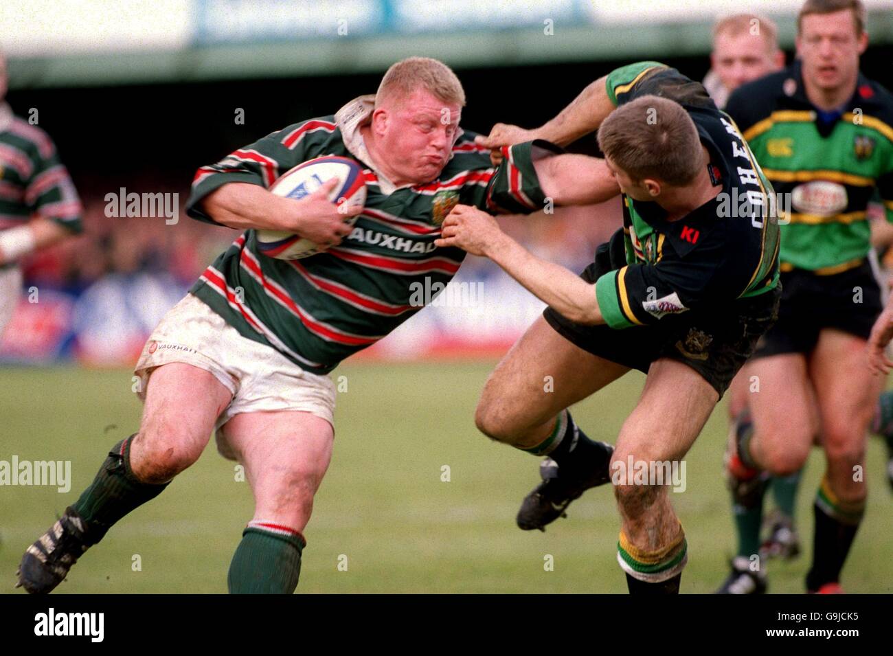 Northampton Saints' Ben Cohen (r) is knocked backwards by Leicester ...