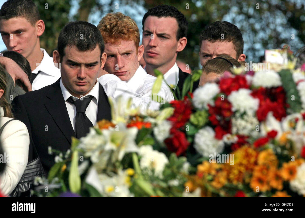 Friends of Kieran Hagen, 20, and Gary McCormack, 21, listen to their ...