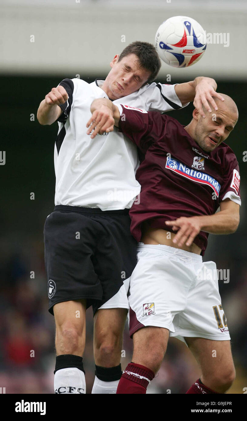 Northamton's David Hunt and Swansea's Owain Tudur Jones compete for the ...