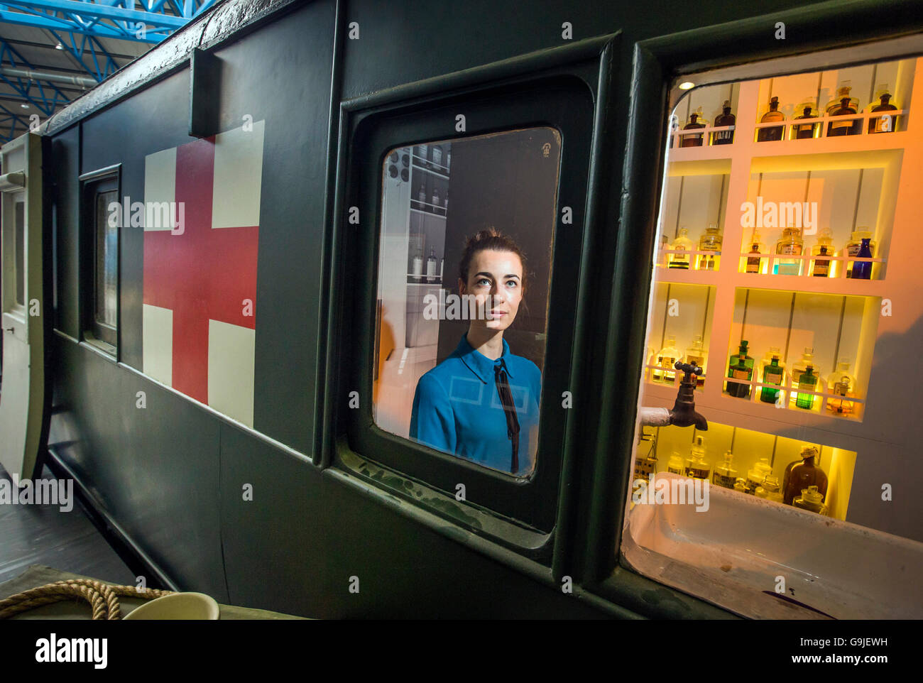 National Railway Museum employee Lydia Onyett in a train window as the ...