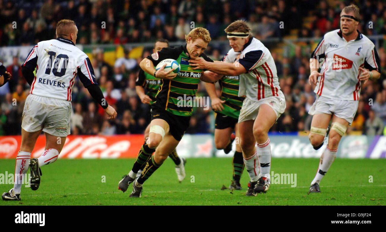 Northampton's Luke Myring (centre) is stopped by Border's Gavin Kerr ...