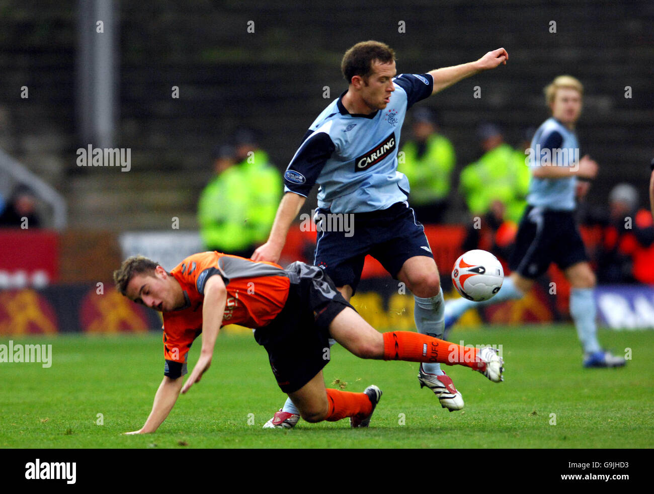 Dundee United's Greg Cameron and Rangers' Charlie Adam battle for the ...