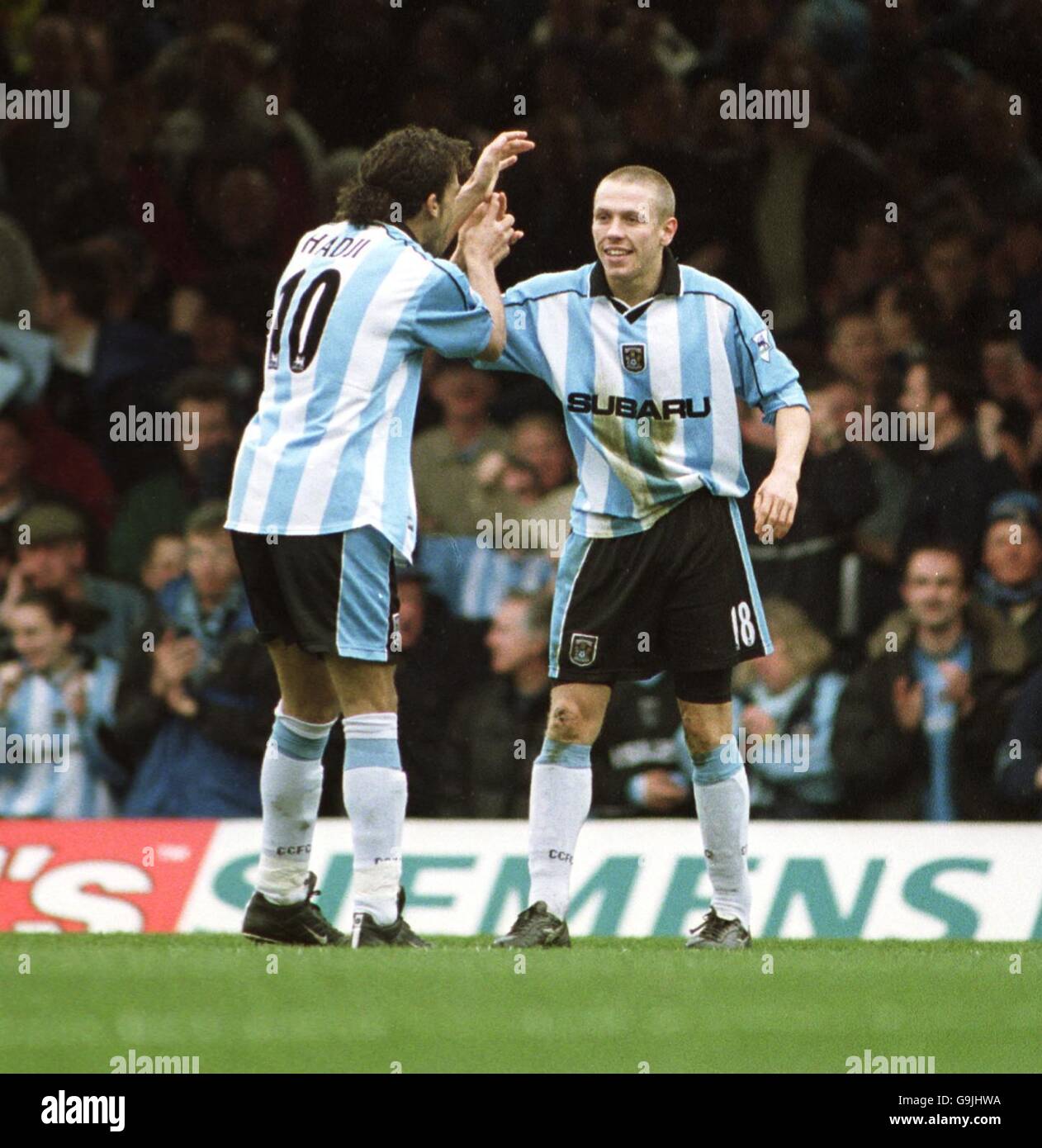 Coventry City's captain Mustapha Hadji (L) congratlates team mate Craig ...