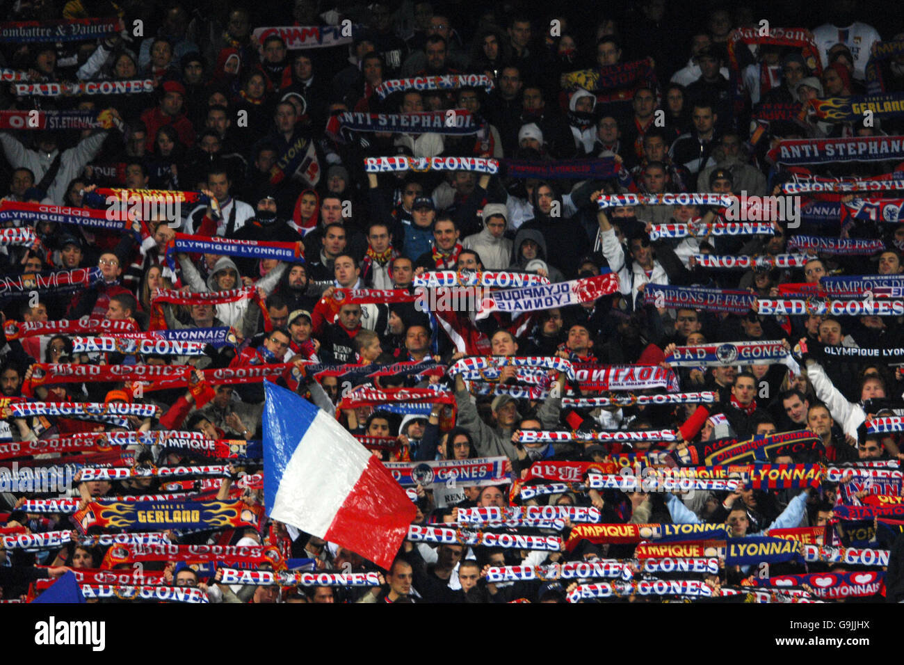 Olympique lyonnais fans with scarves and banners hi-res stock ...
