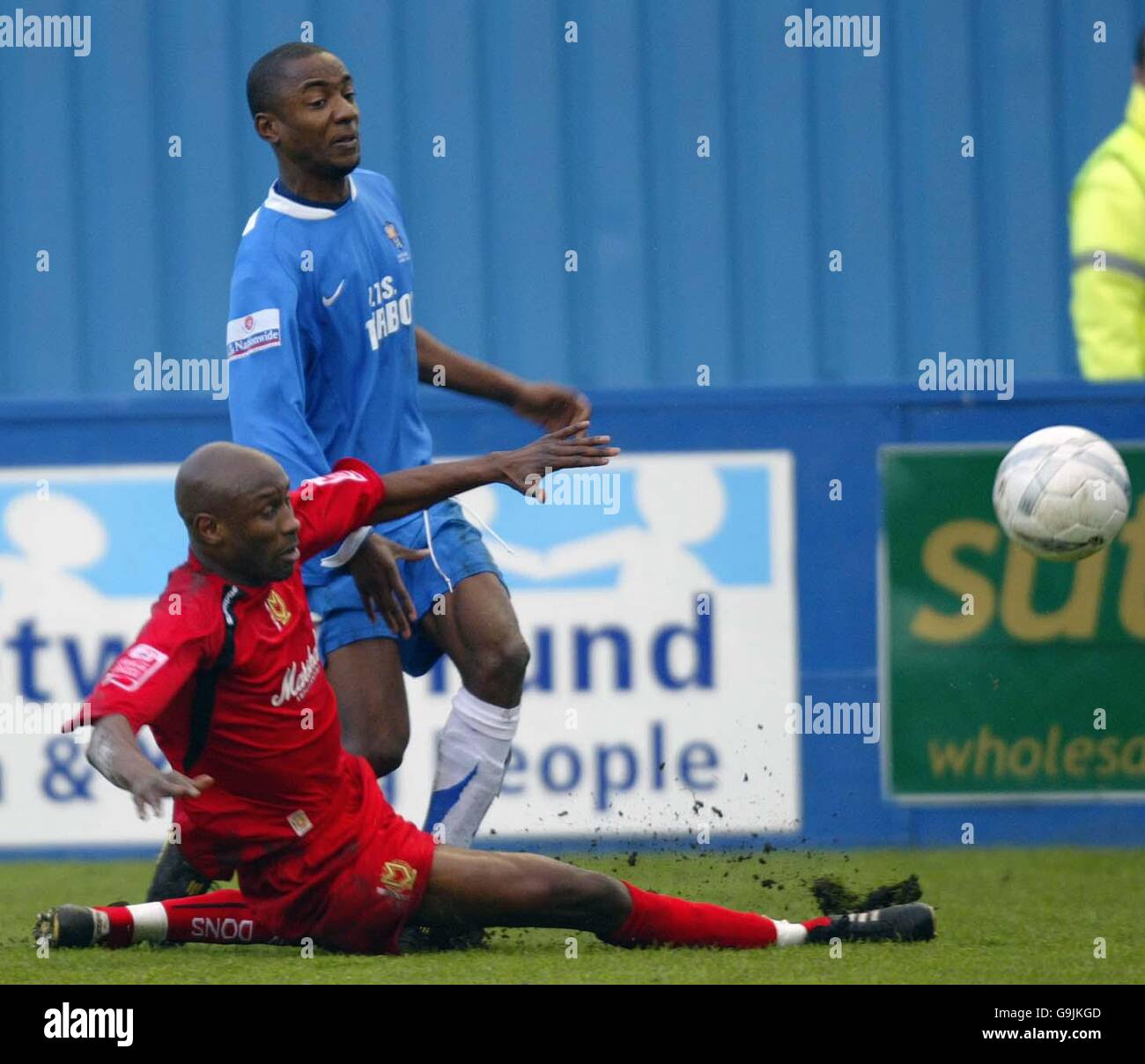 Farsley Celtic's Gareth Grant and Milton Keynes Don's Drissa Diallo ...