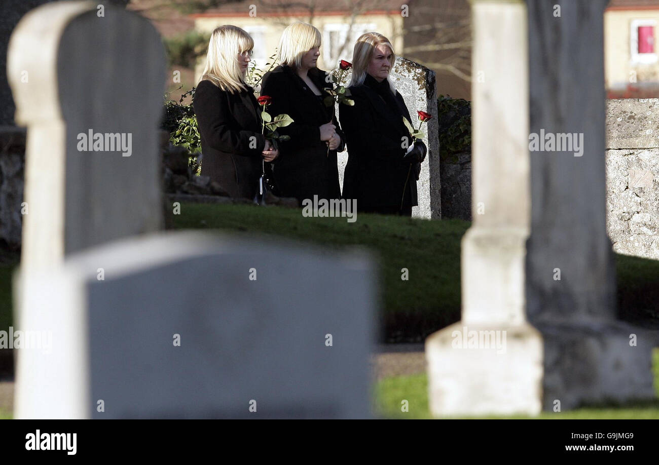 Fiona Bell with daughters Charlene and Anne-Marie follows the casket as ...