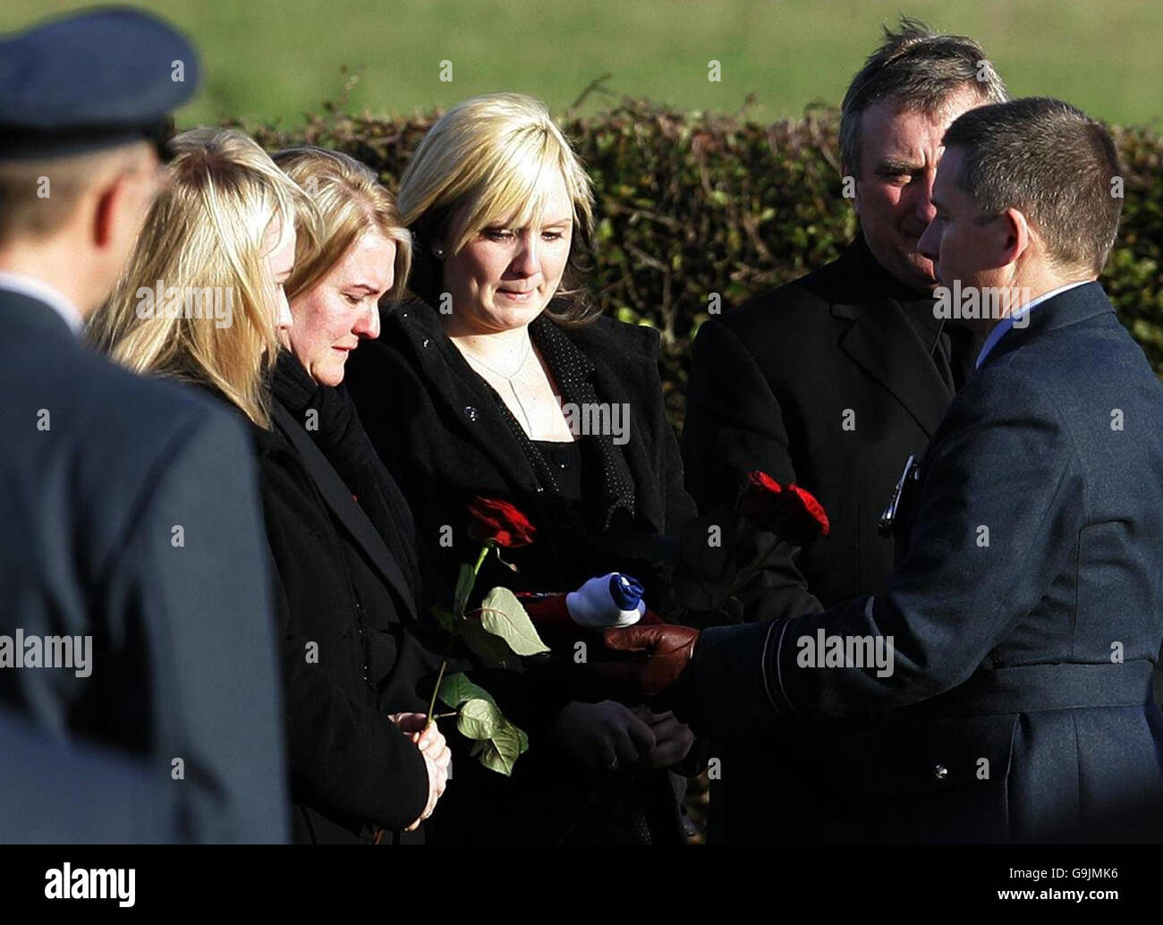 Fiona Bell is handed the Union Jack flag as daughters Charlene and Anne ...