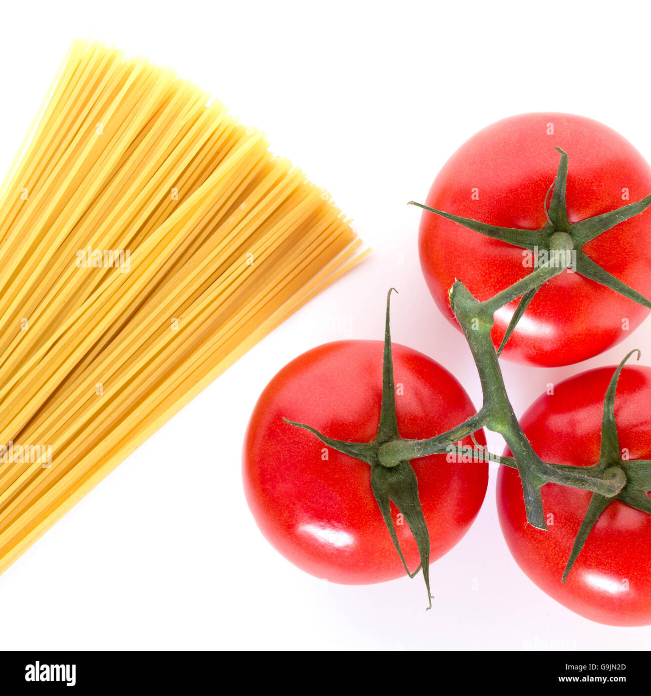 Simple spaghetti ingredients on white background viewed from the top ...