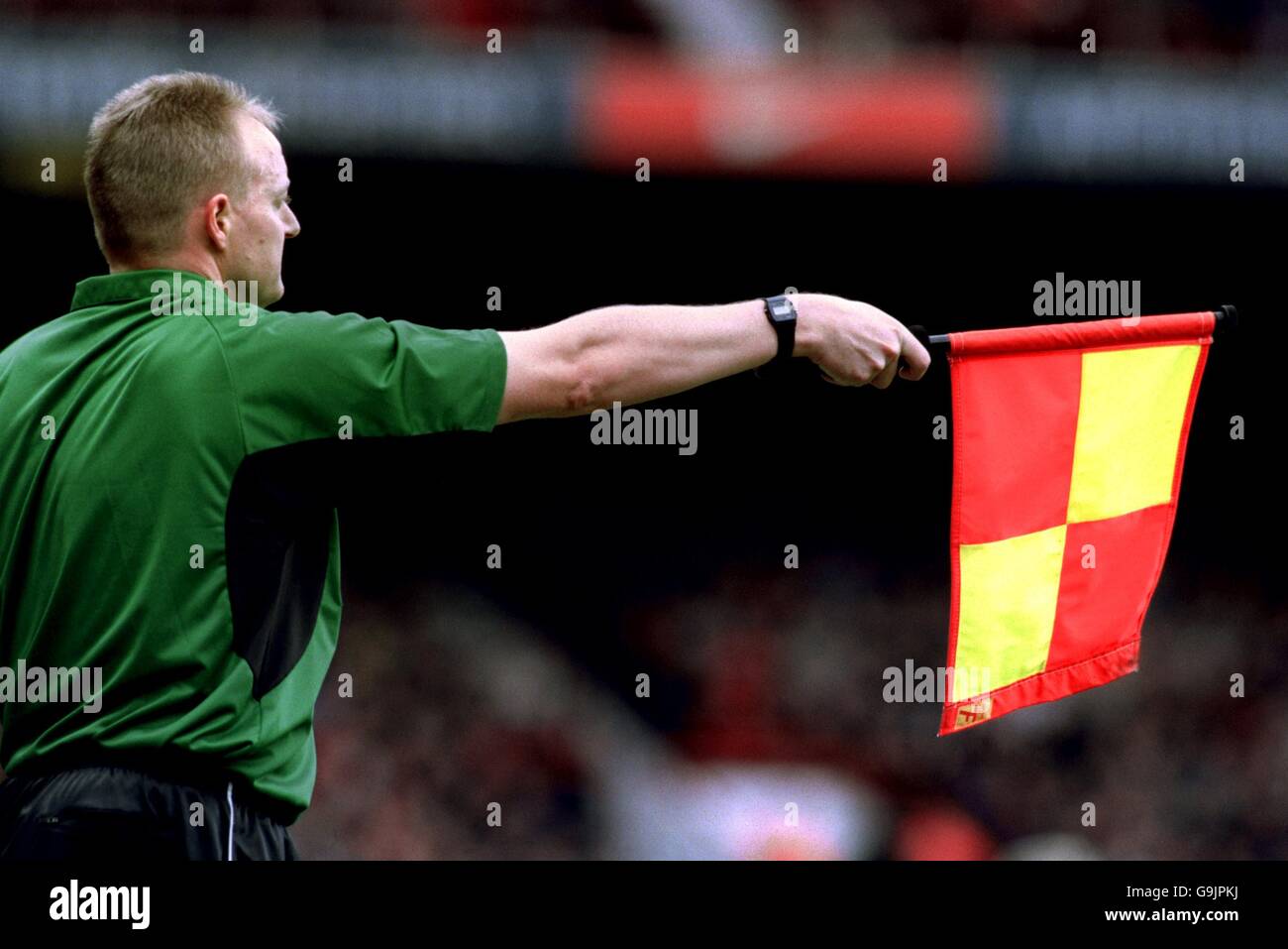 The assistant referee flags for an offside after letting Arsenal's ...