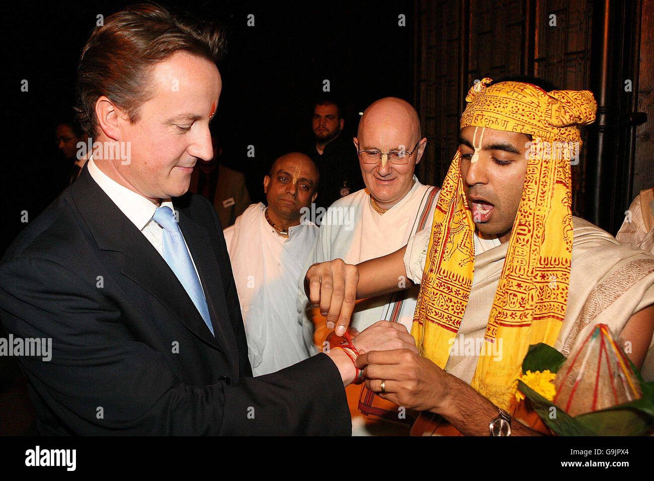 Brahmin priest Sri Radha Raman (right), greets Conservative party ...
