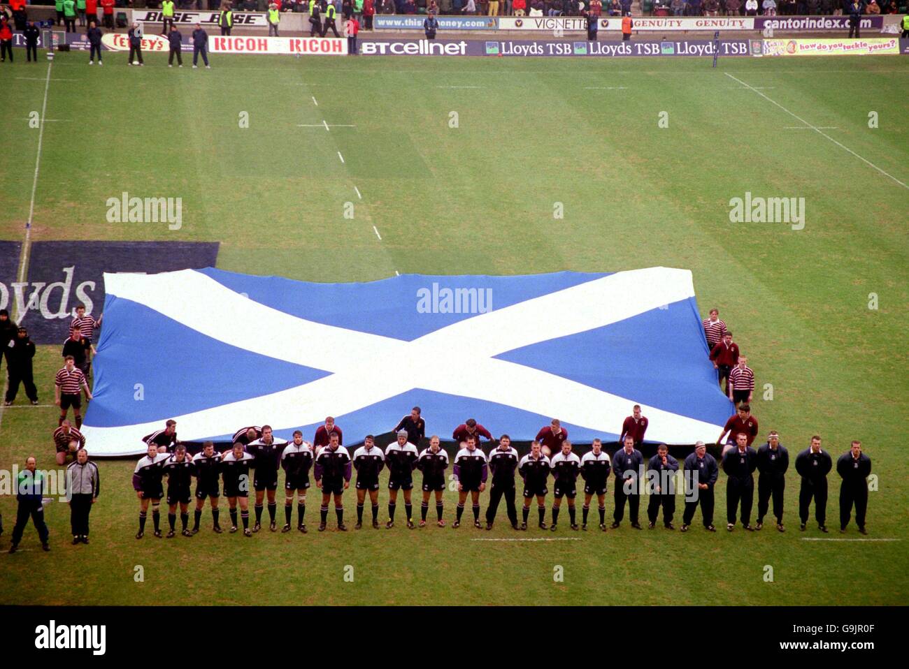 The Scotland team line up in front of their national flag Stock Photo ...