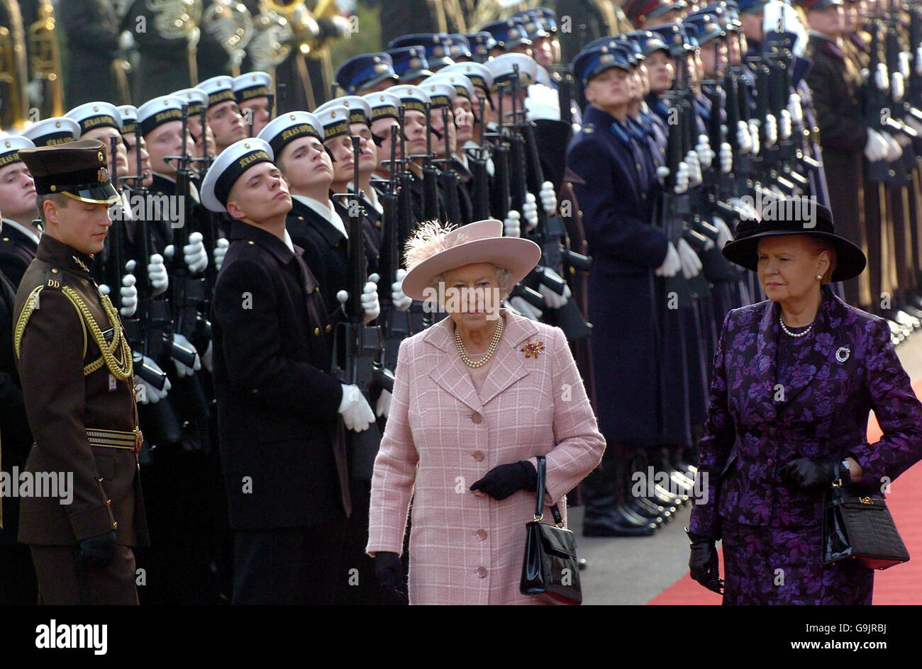 Britain's Queen Elizabeth II inspects the guard of honour alongside the ...