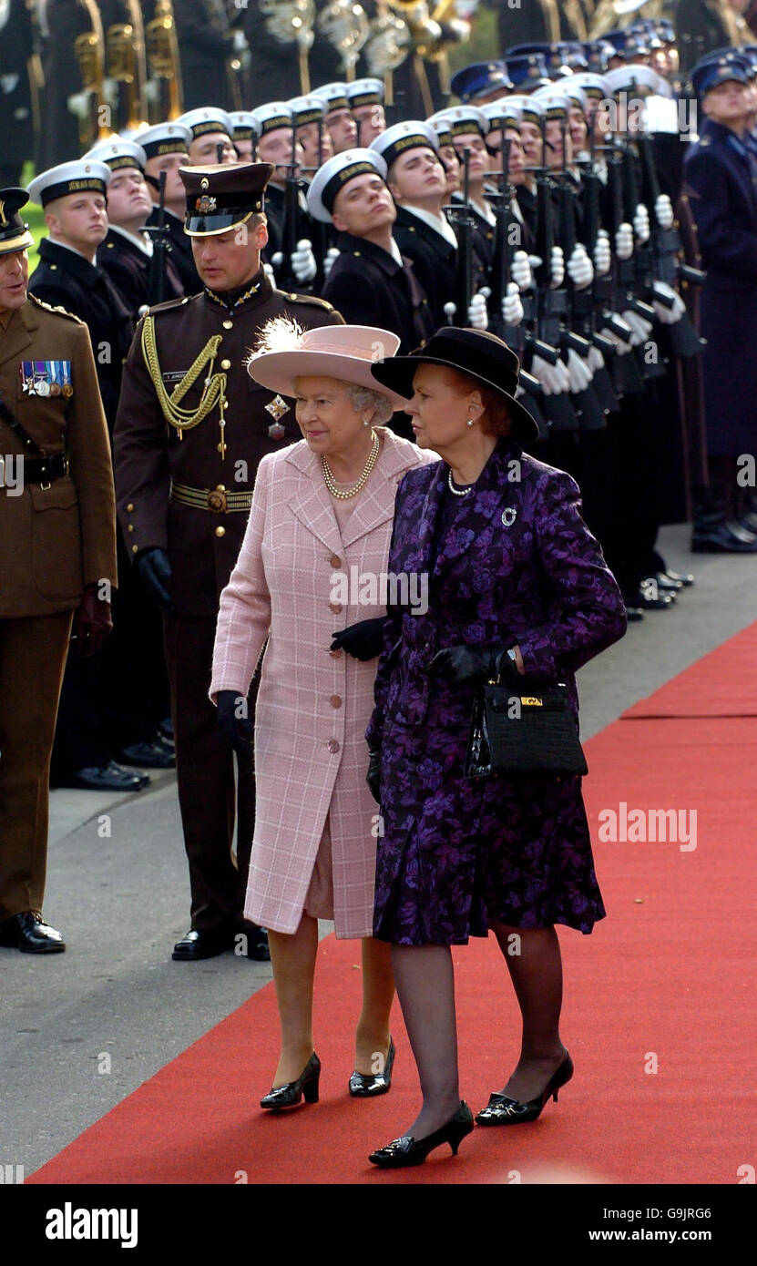 Britain's Queen Elizabeth II inspects the guard of honour alongside the ...