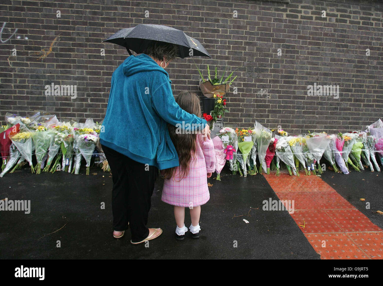 Flowers are laid by well-wishers at the site of a fatal hit-and-run ...