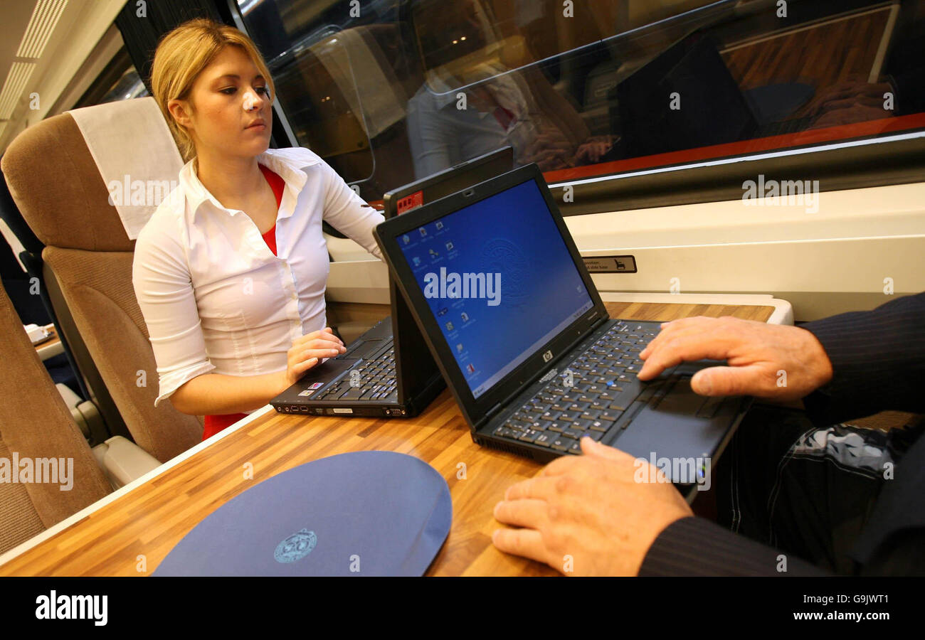Two member of the public use laptops on board a GNER train, as the East ...