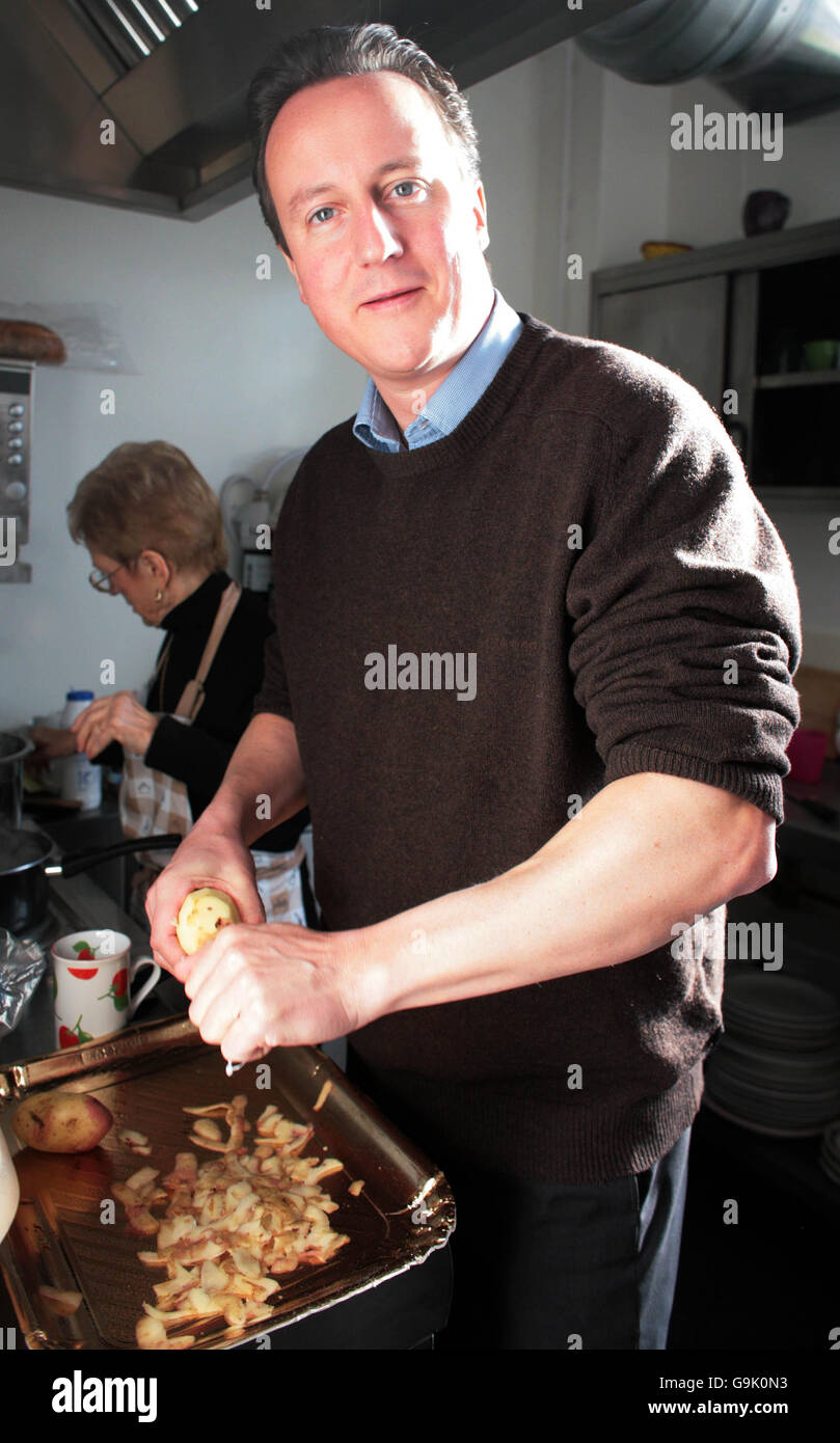 Leader of the Conservative Party David Cameron peels potatoes on a ...