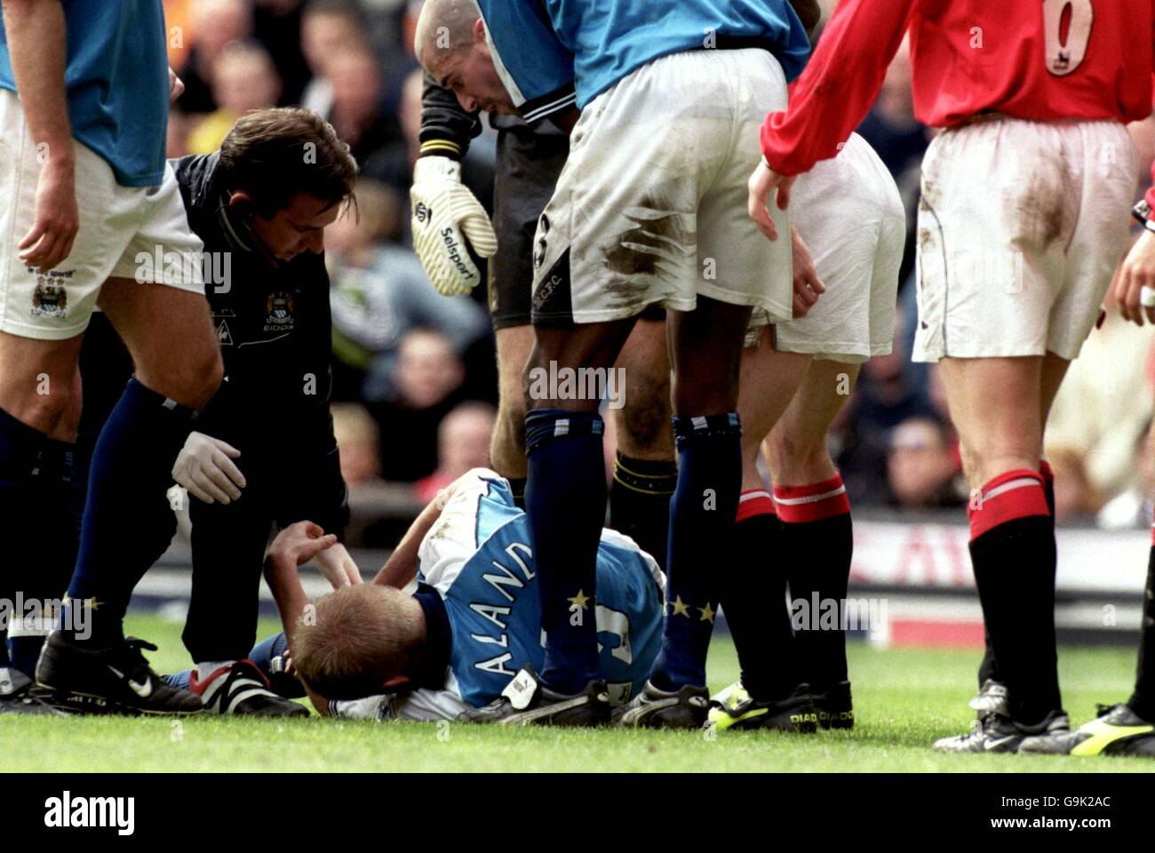 Manchester United's Roy Keane (top) takes a look at Manchester City's ...