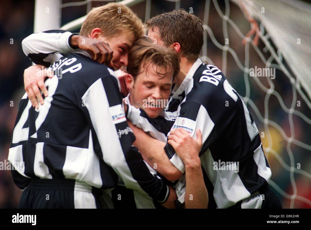 Notts County's Kevin Nicholson is congratulated by Danny Allsopp and ...