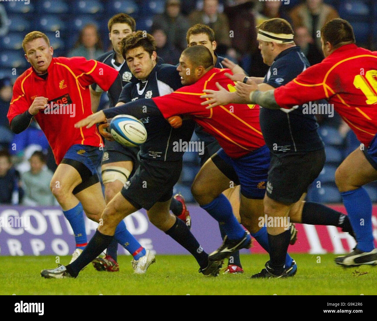 Scotland's Marcus DI Rollo (centre left) holds off Romania's Florin ...