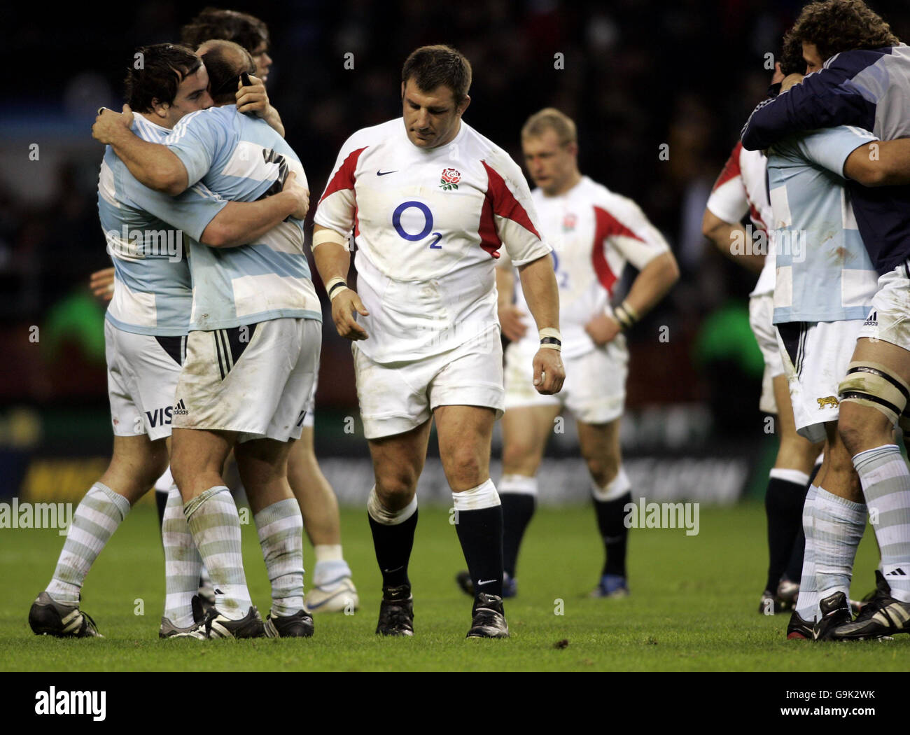 England prop Julian White (centre) walks off as Argentina players ...
