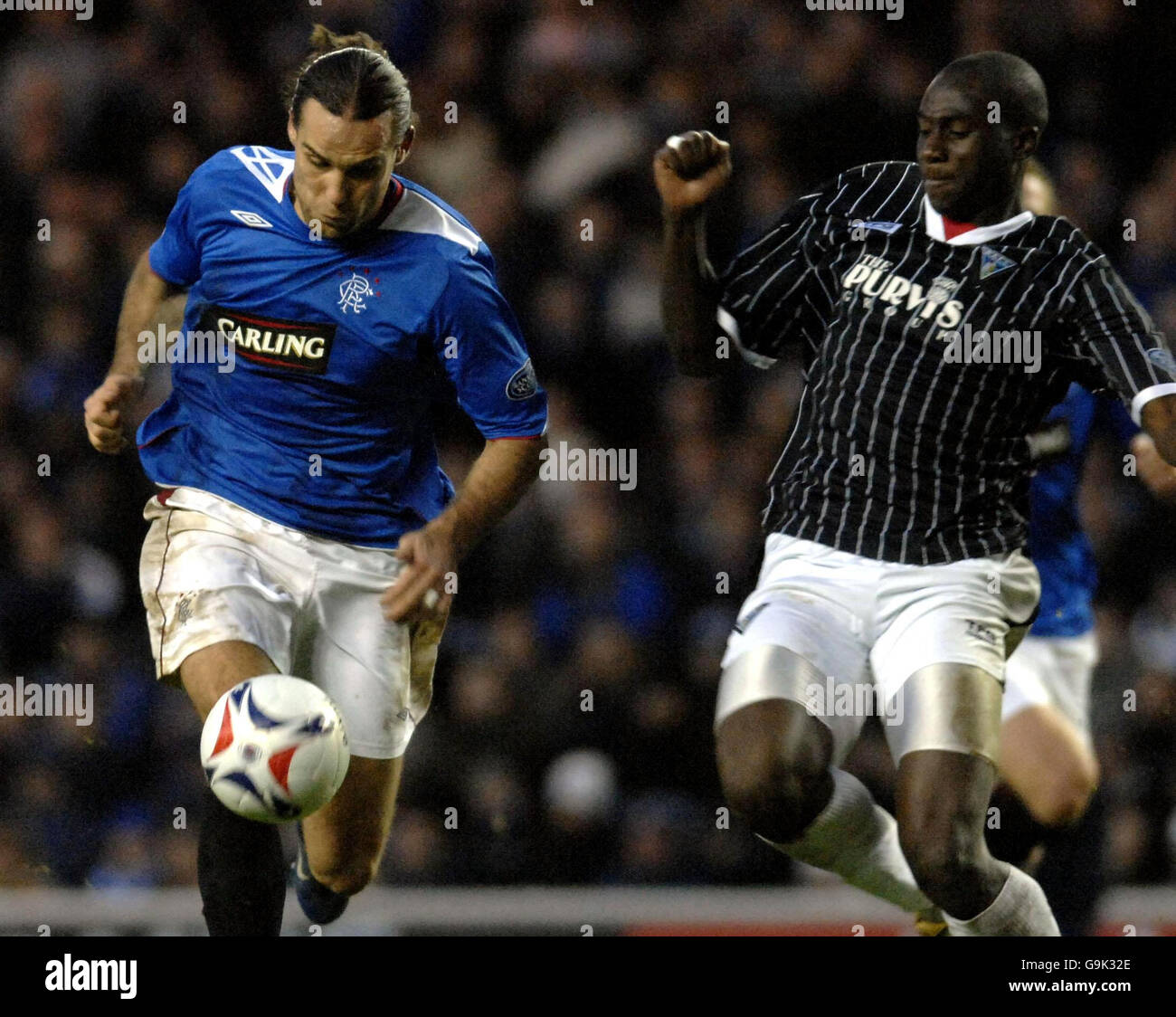 Rangers' Dado Prso (left) takes the ball away from Souleymane Bamba of ...