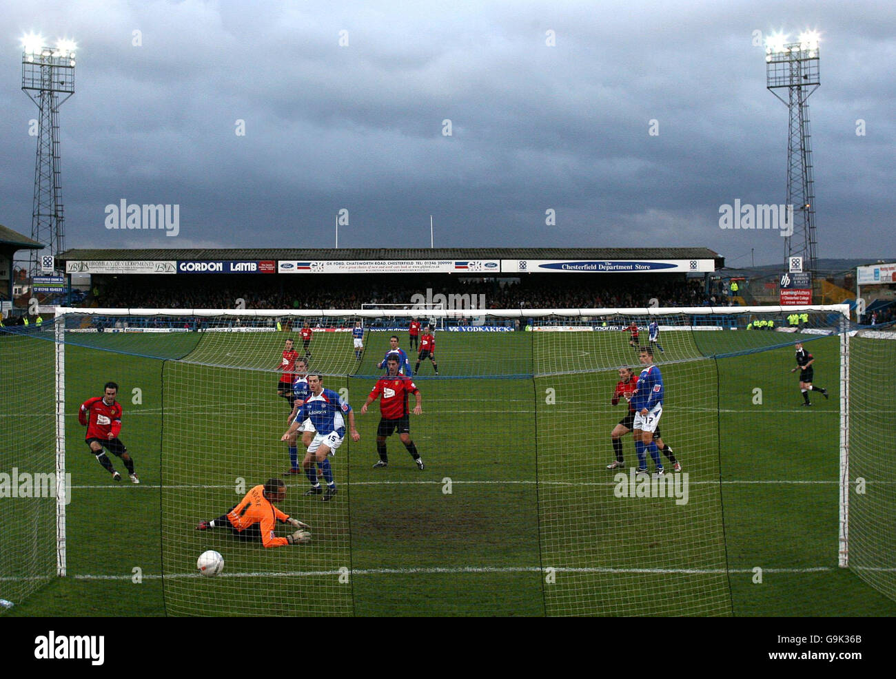 Basingstoke's Matthew Warner (far left) squeezes the ball over the line ...