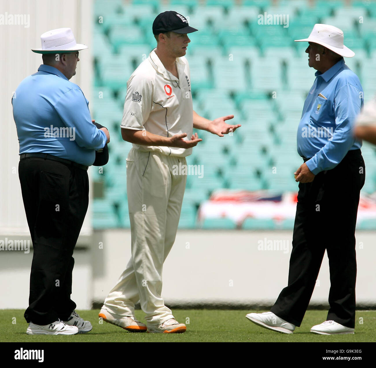 England captain Andrew Flintoff (left) talks to umpires Darren Goodger ...