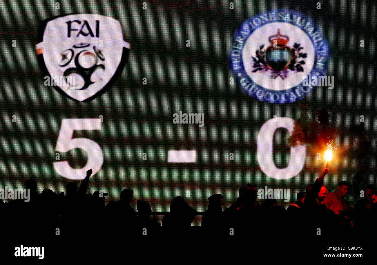 Republic of Ireland fans celebrate in front of the giant scoreboard ...