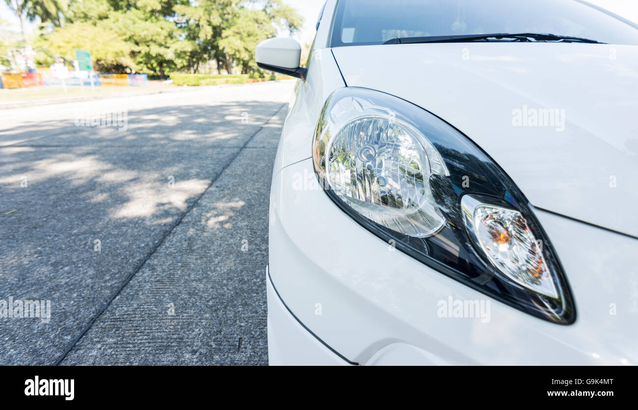 Close - up light car on the road Stock Photo - Alamy