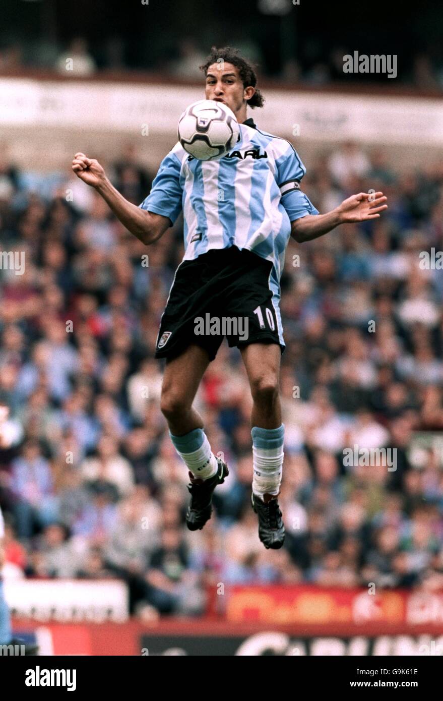 Coventry City's Moustapha Hadji controls the ball on his chest while in ...