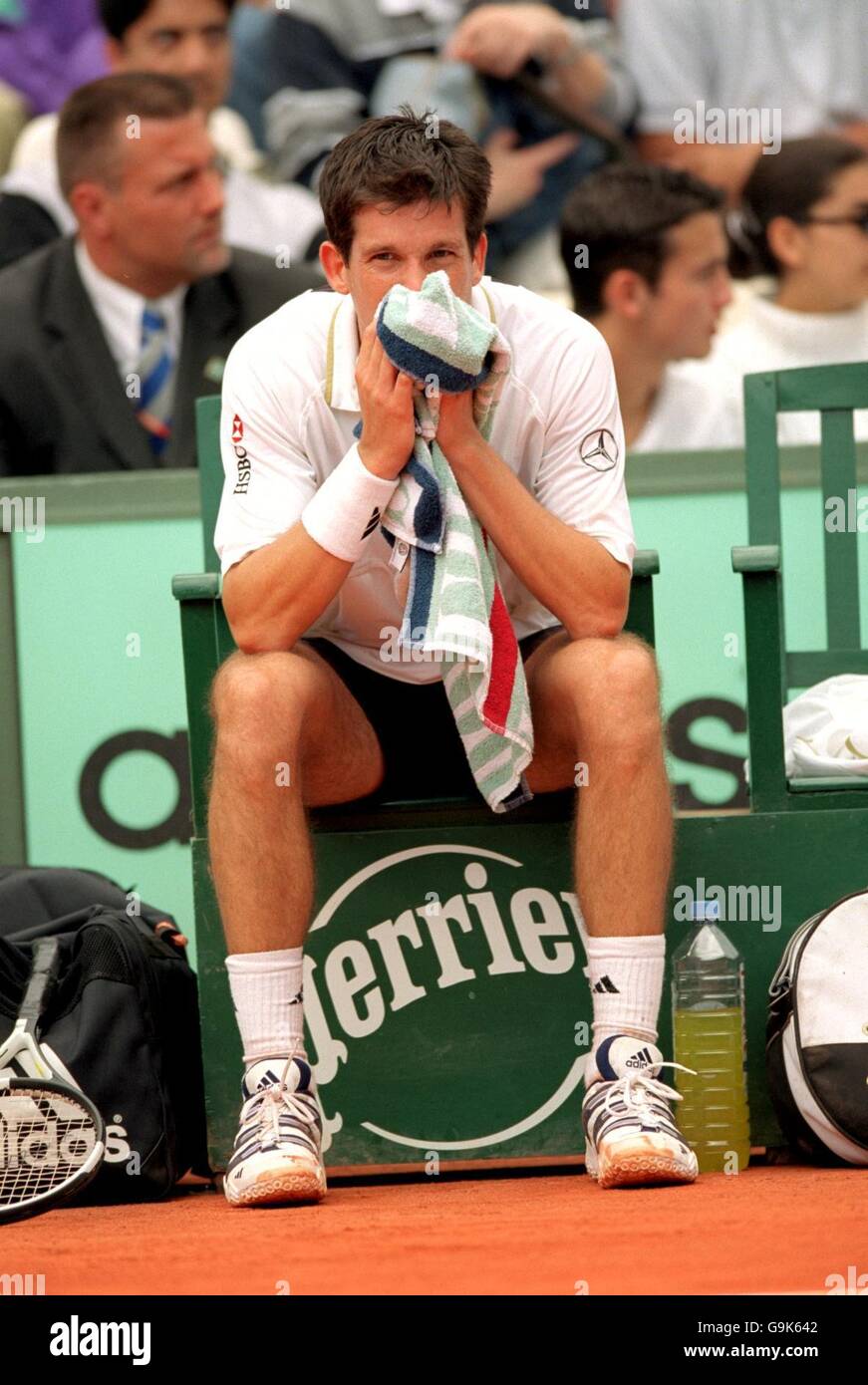 Tennis - French Open - First Round. Tim Henman wipes his face during ...